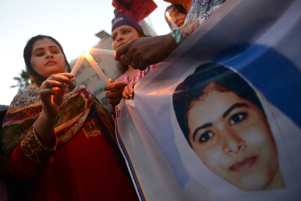 Malala Yousafzai awake and standing, say British doctors - The World ...