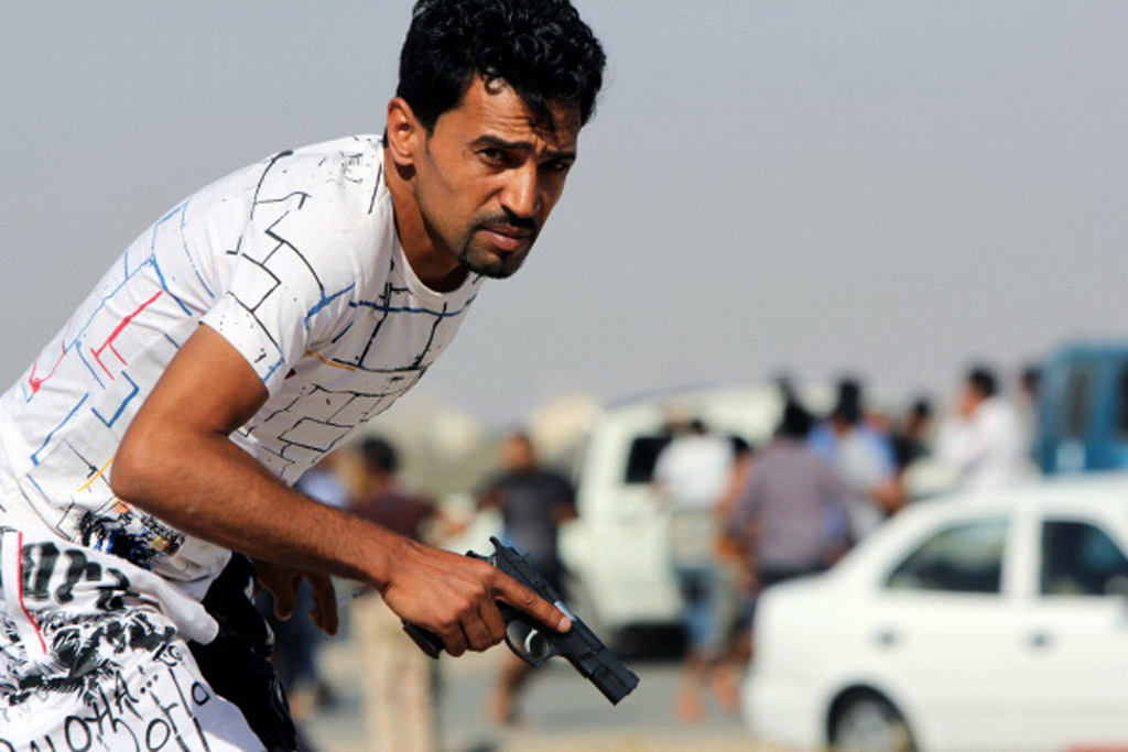 Libya's top general quits after protests turn violent, kill 31 - The ...