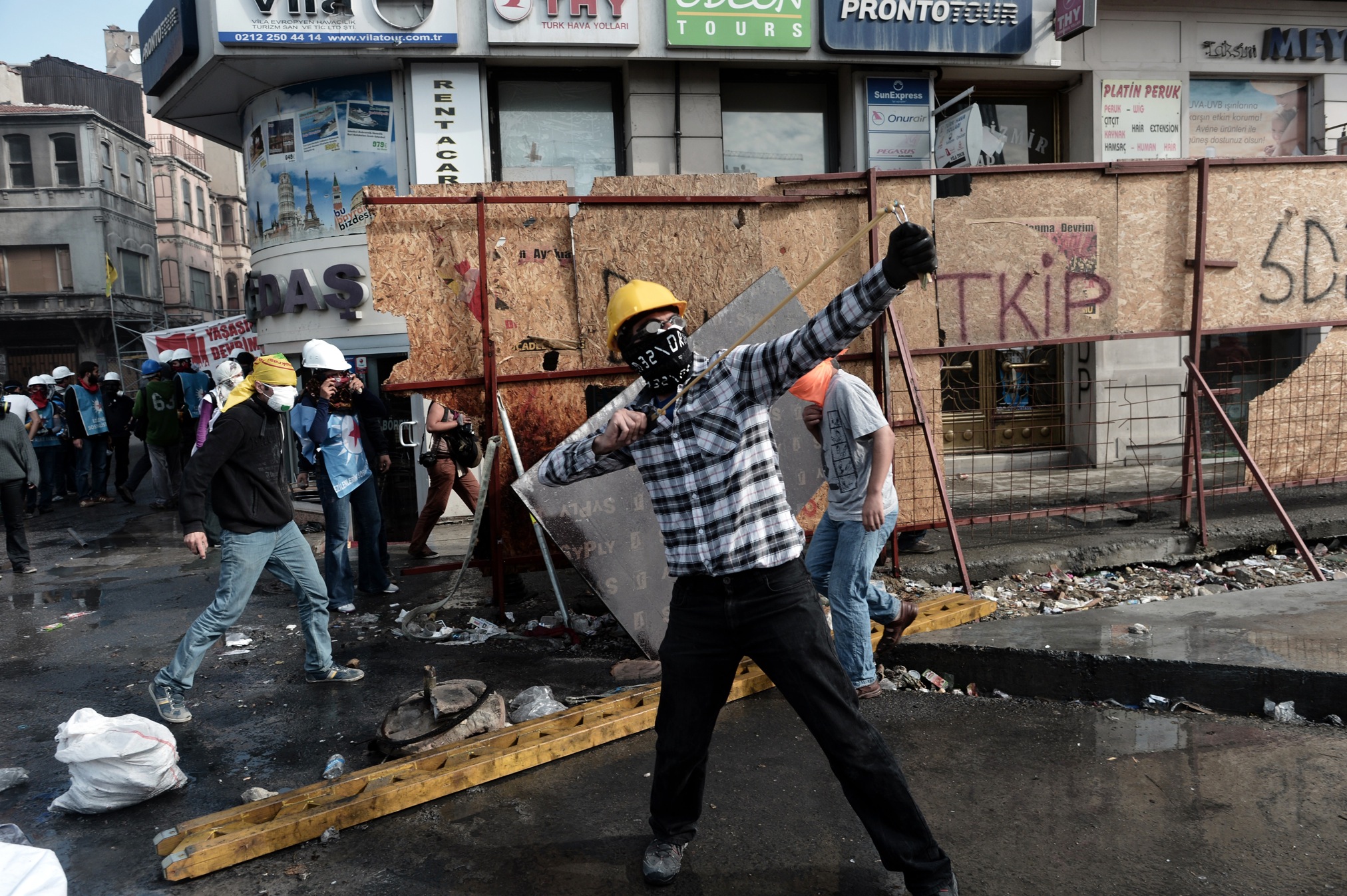 Turkish riot police clash with protesters into the night, as Erdogan ...