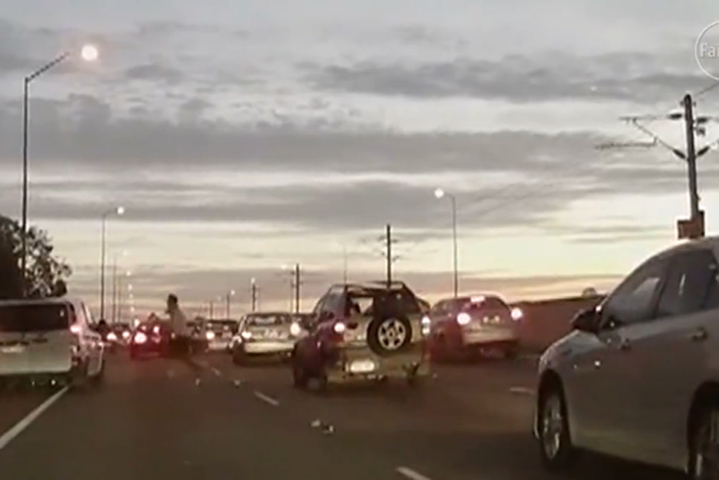 Crazed commuter headbutts moving cars in Australia (VIDEO) - The World ...
