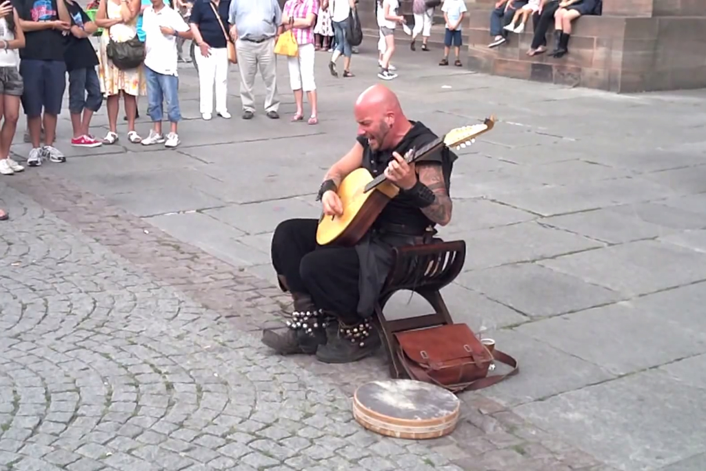 Check out this street performer in Strasbourg. He is a medieval bard ...