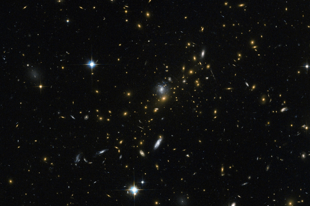This distant galaxy cluster is so huge it can actually bend light - The ...