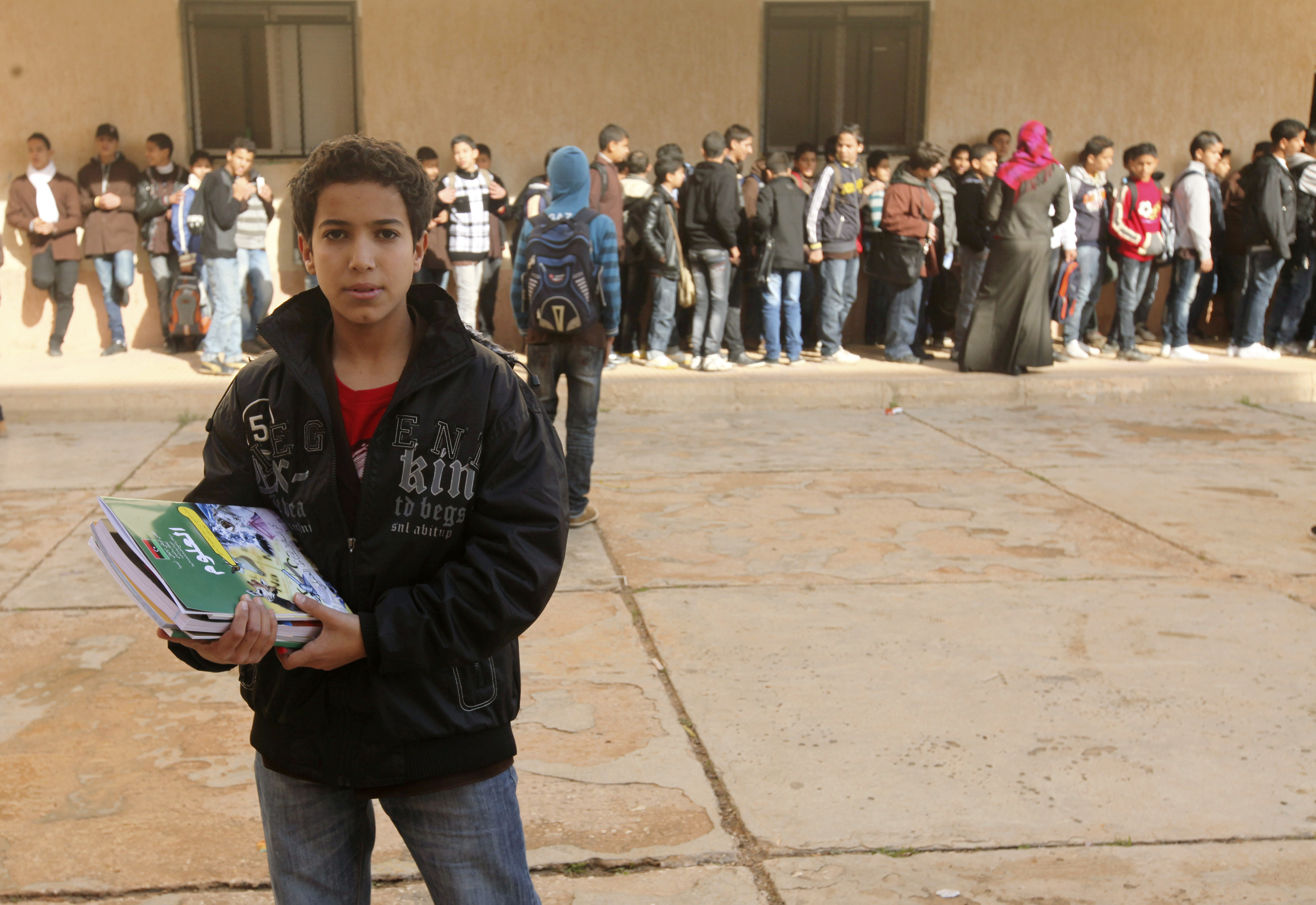 Kids in Libya have been out of school for months, so this woman is ...