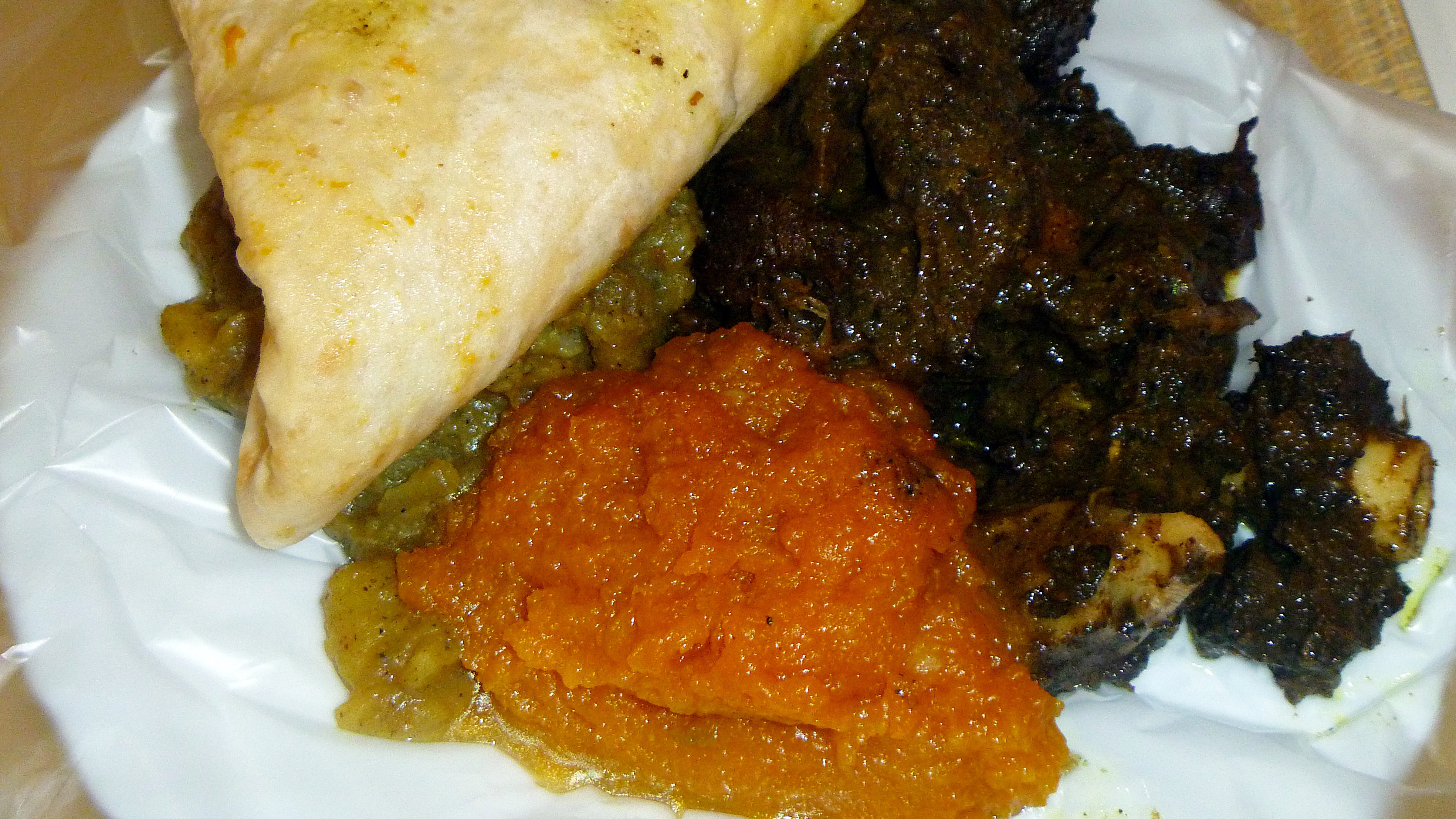 What Caribbean island is known for its traditional bread dish, roti ...