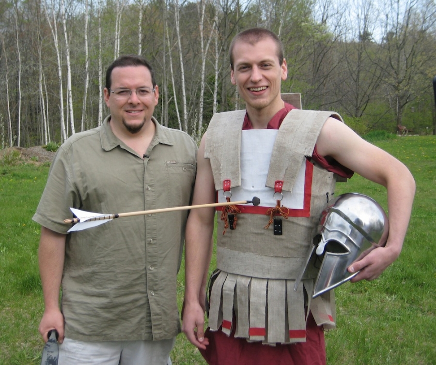 Why did Greek war dress resemble linen mini-dresses?