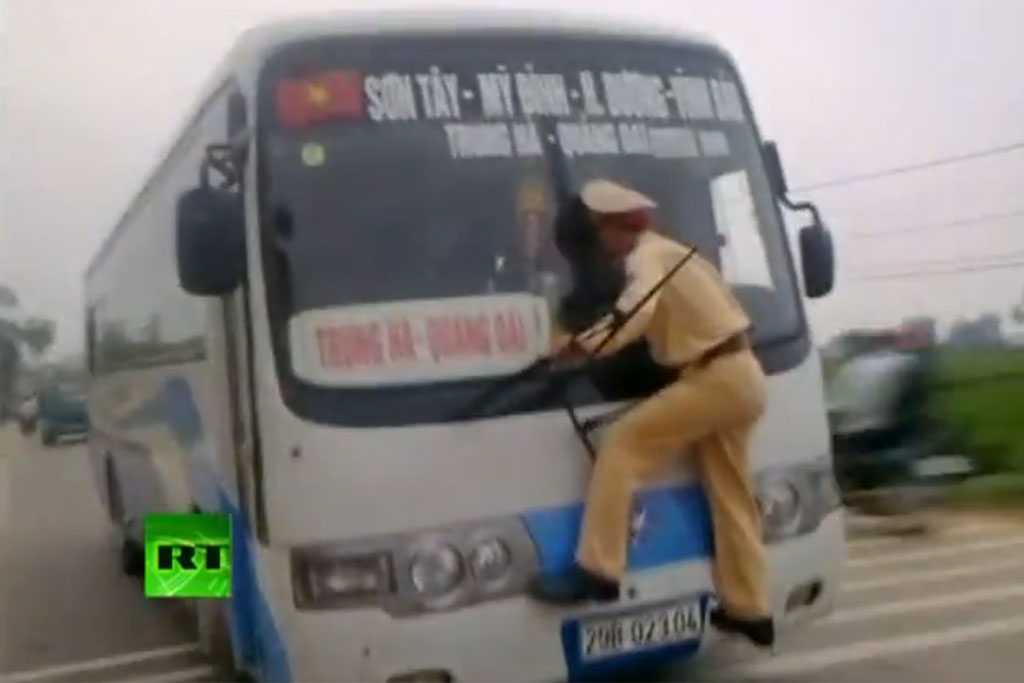 Cop hitches a ride on bus windshield - The World from PRX